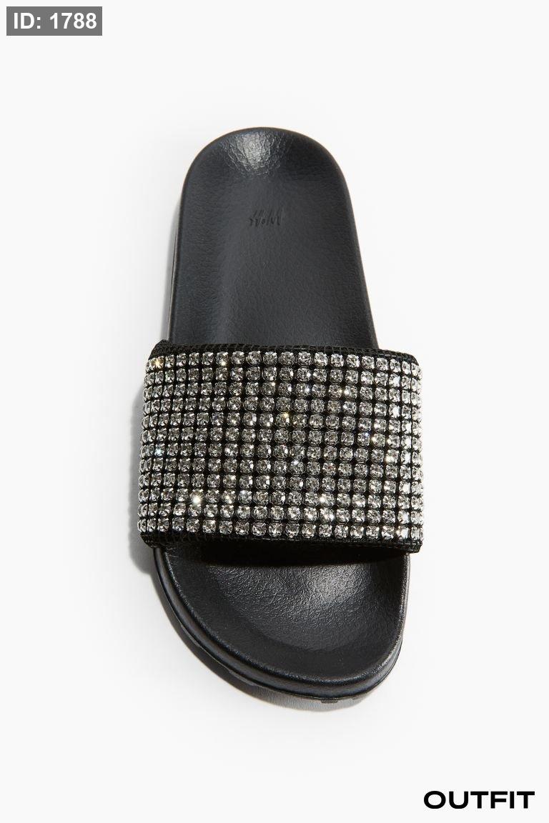 Slippers decorated with artificial gems